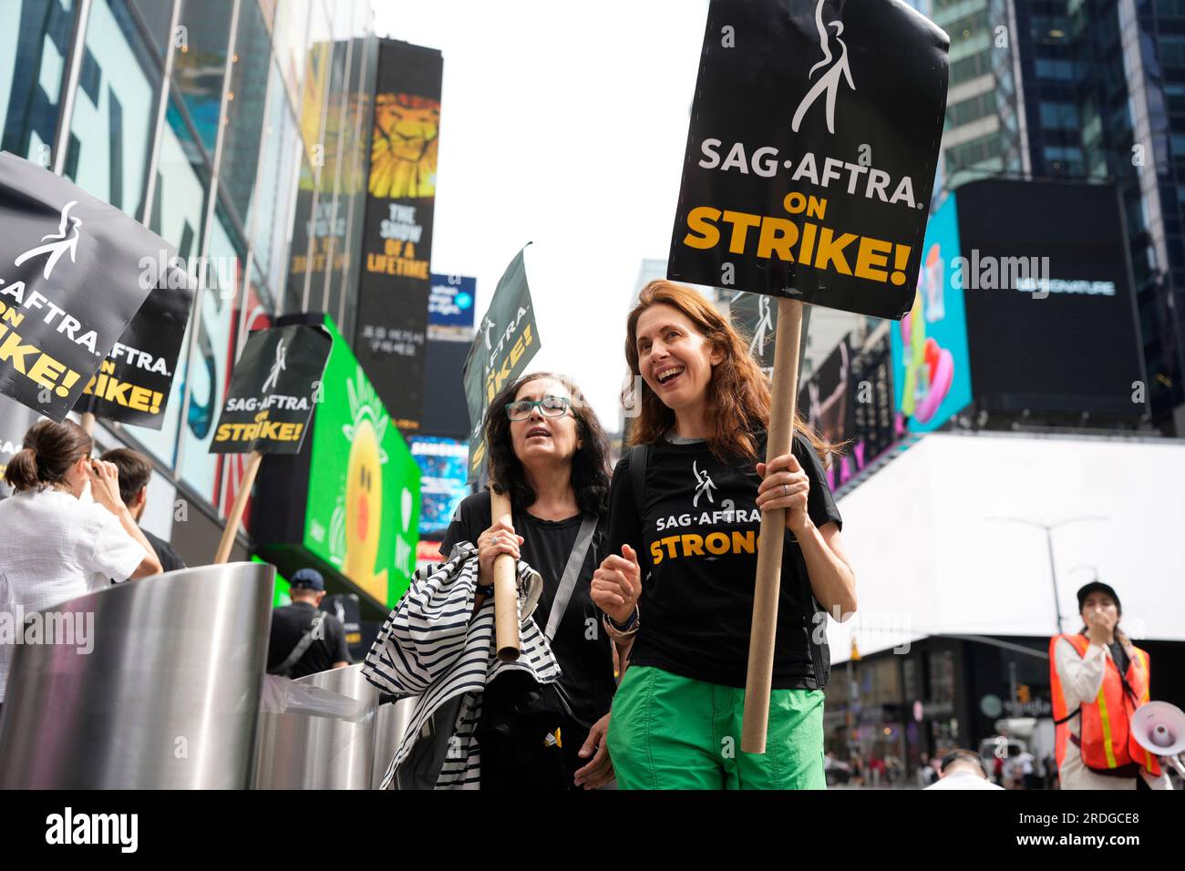 Picketers carry signs outside Paramount in Times Square on Friday, July ...