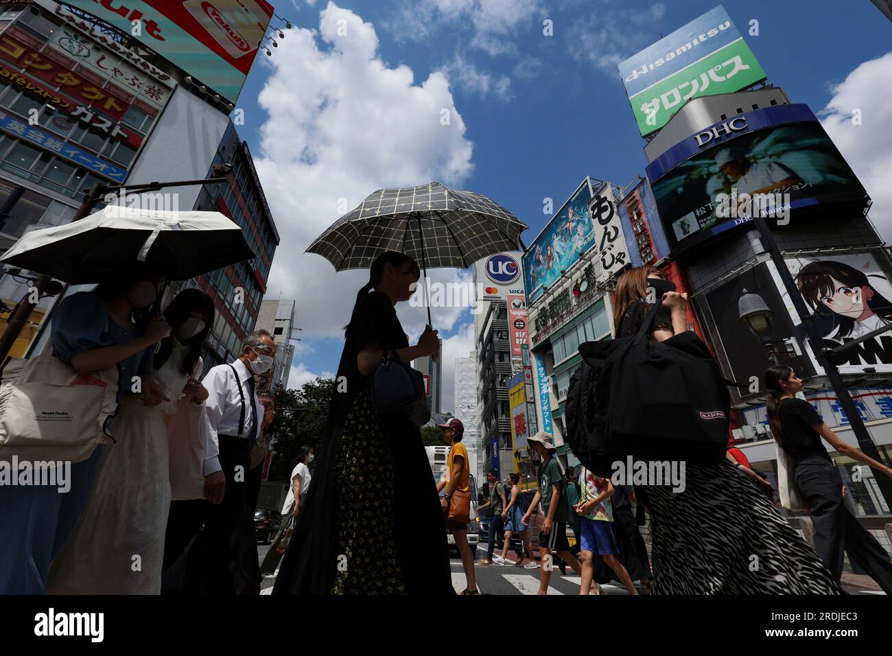 People walk on a street in Shibuya Ward, Tokyo, on July 22, 2023. The ...