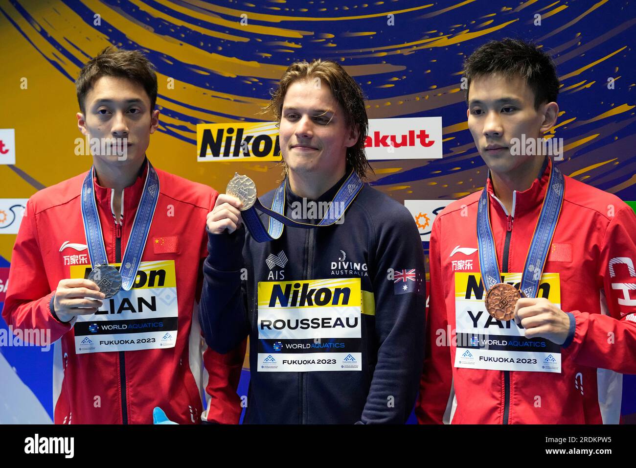 Gold medalist Cassiel Rousseau of Australia, center, is flanked by ...