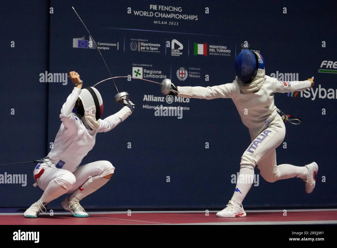Italy's Alberta Santuccio, right, competes with Poland's Martyna ...