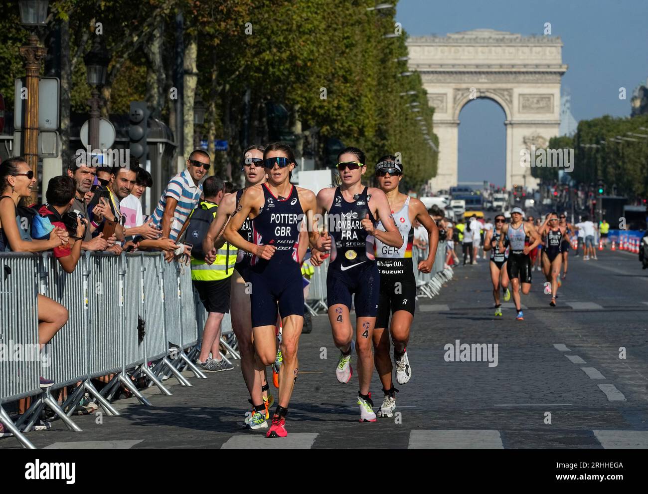 Beth Potter of Great Britain leads the back on the run leg on the ...