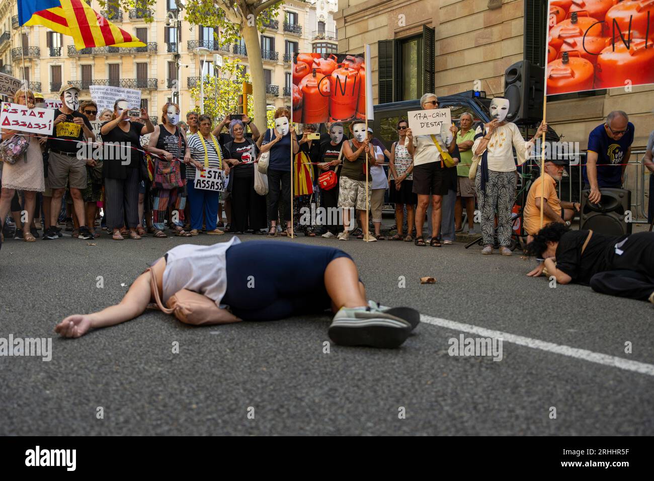 A person lies on the ground as if he were one of the victims of the attacks during a rally ...