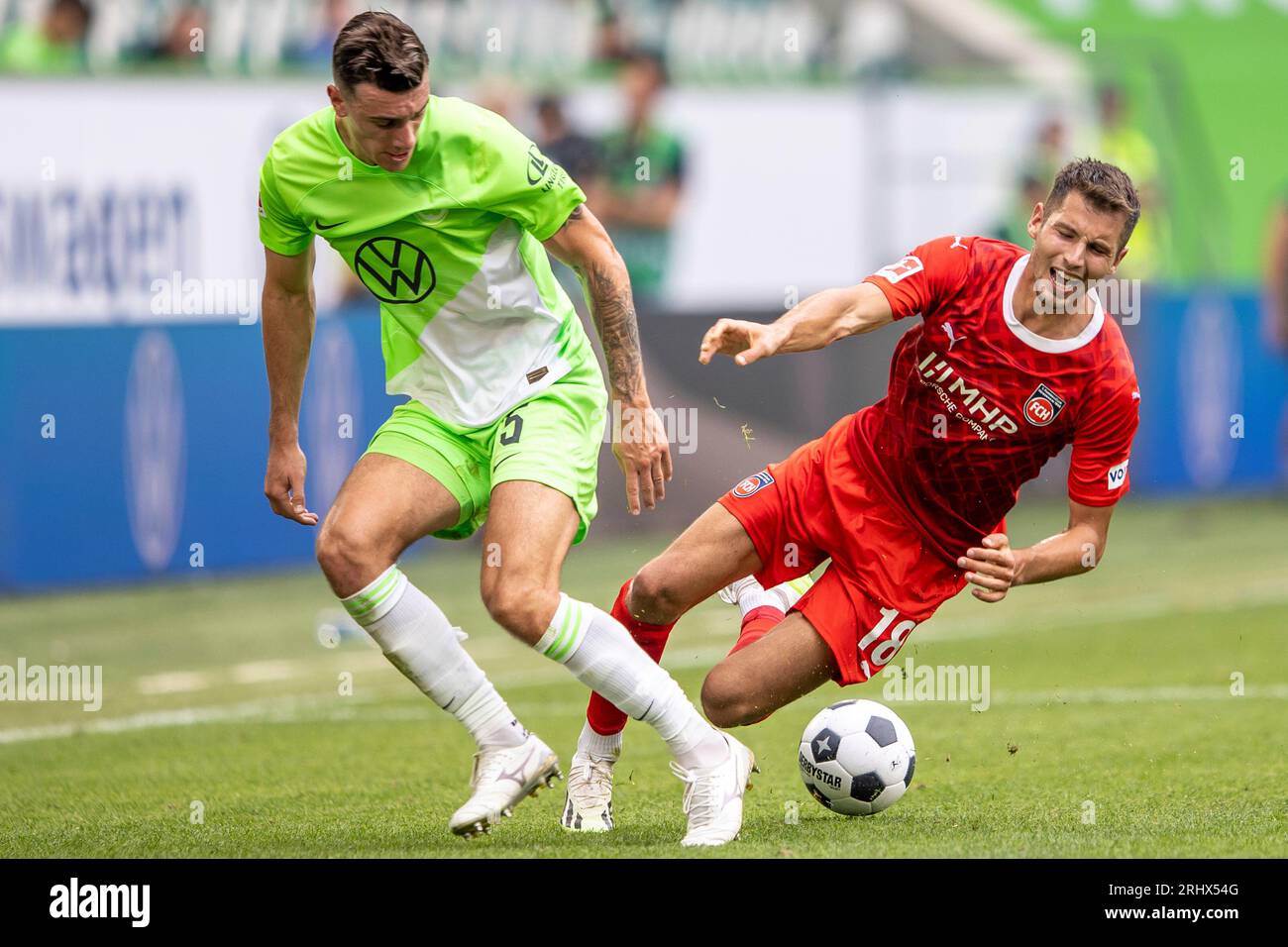 Wolfsburg's Cedric Zesiger, left, and Heidenheim's Marvin Pieringer ...
