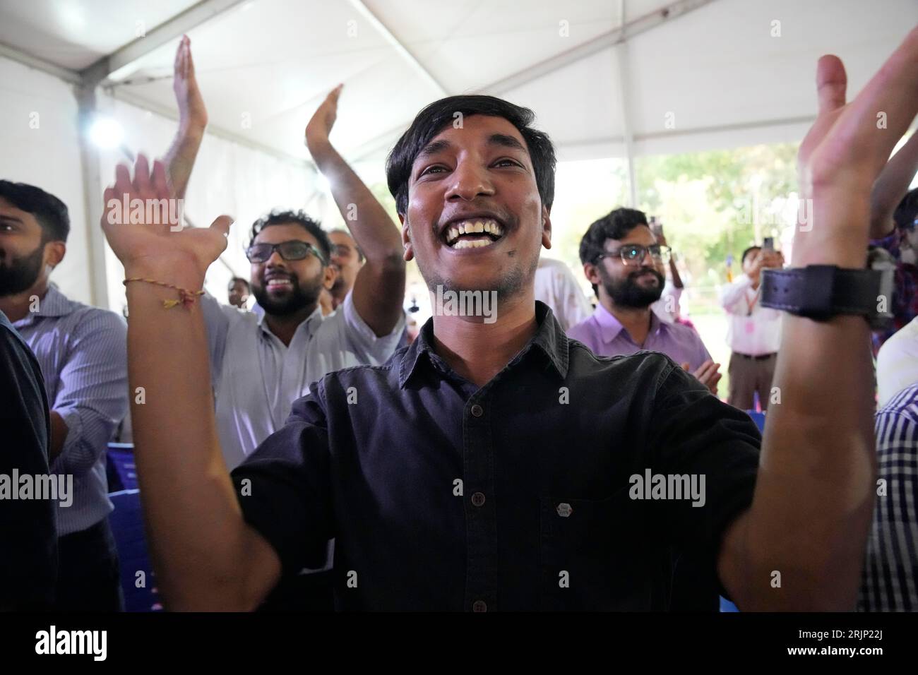 An Indian Space Research Organization (ISRO) scientist celebrates the ...