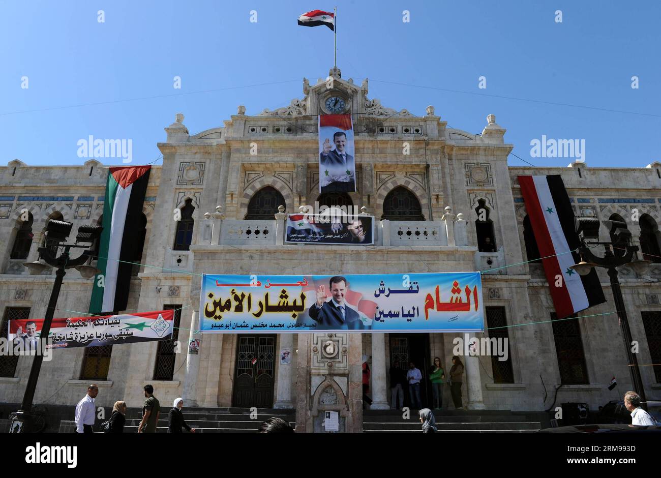 DAMASCUS, May 13, 2014 - Election campaign posters of incumbent ...