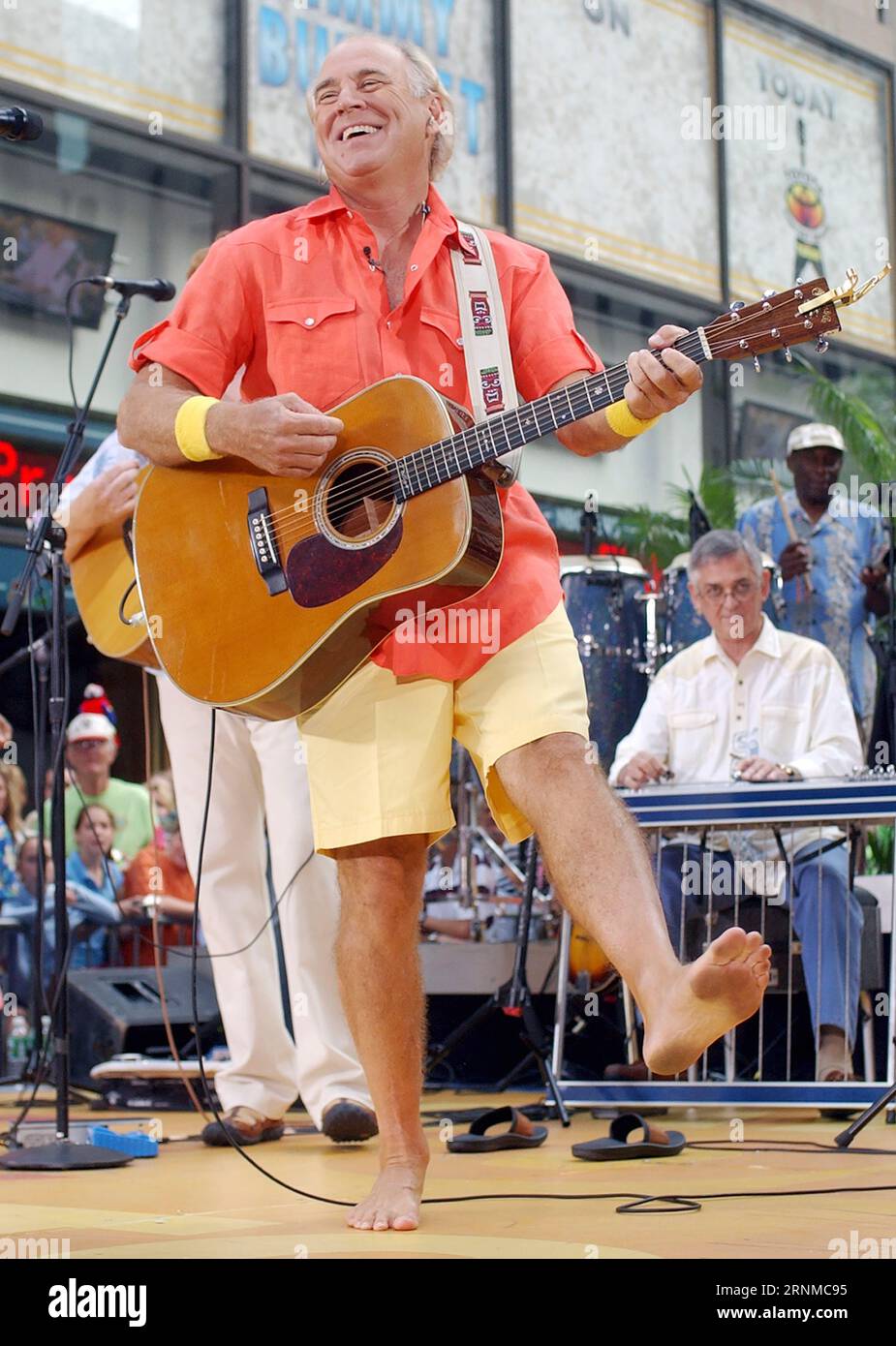 FILE - Singer Jimmy Buffet performs barefooted with his band The Coral ...