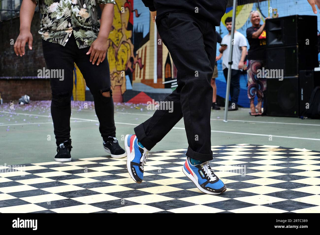 Happy Feet Foot Work Step in Blue Pumas und Black Jeans, Legs Only ...