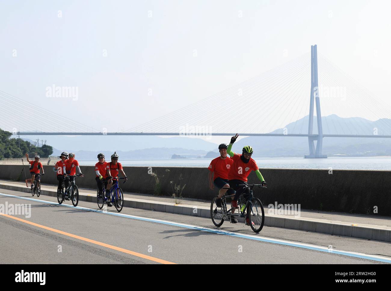 People ride tandem bicycles across Nishiseto Expressway (Shimanami ...