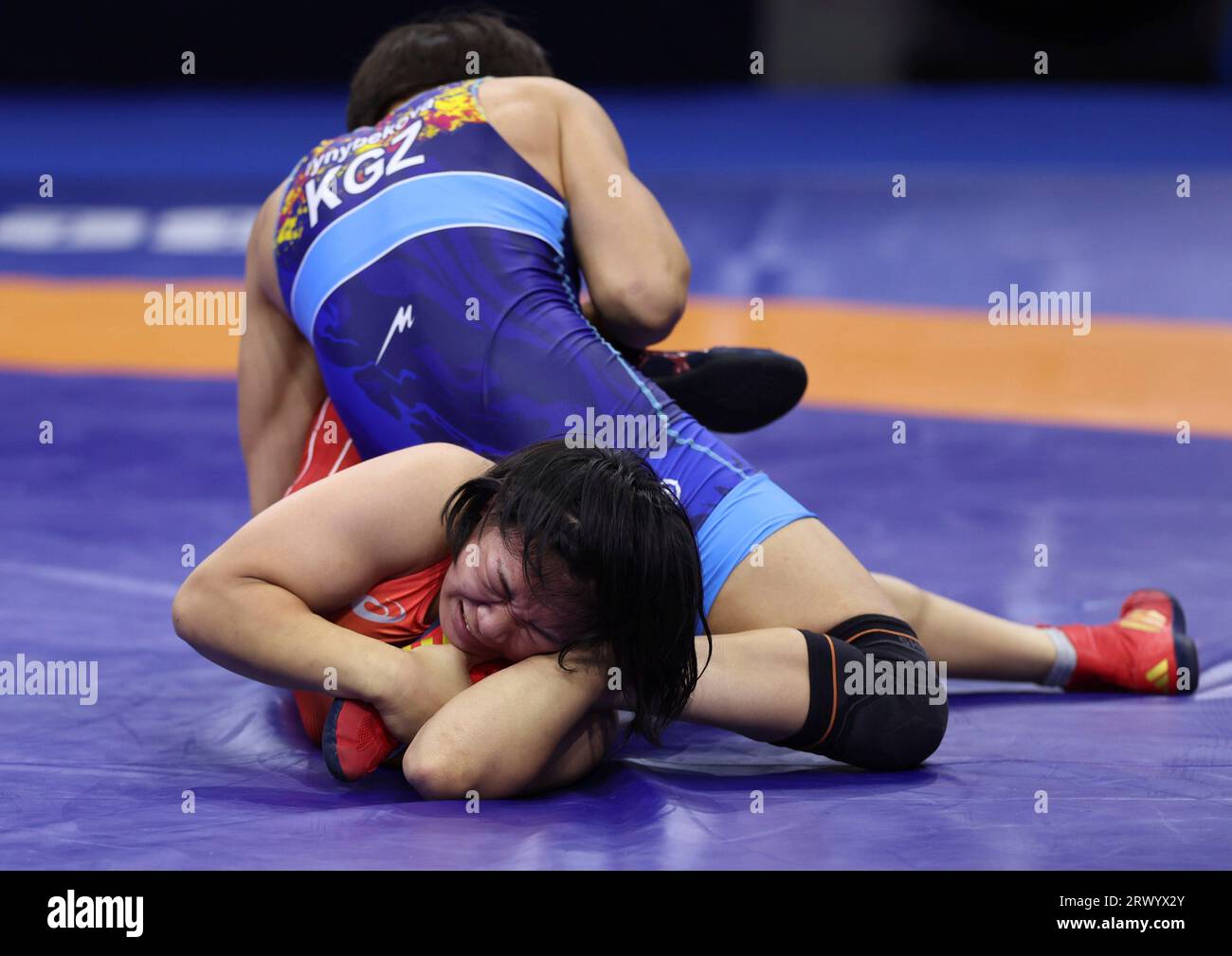 Aisuluu TYNYBEKOVA of Kyrgyz(blue) and Sakura MOTOKI of Japan compete ...