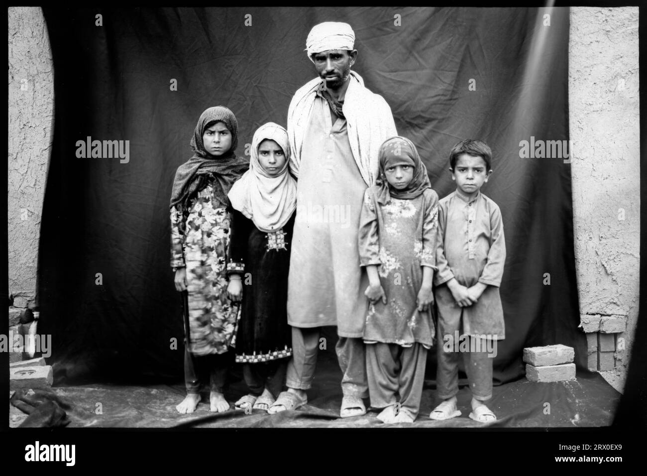 Ibrahim, 30, poses for a portrait with his children, from left, Arzo ...