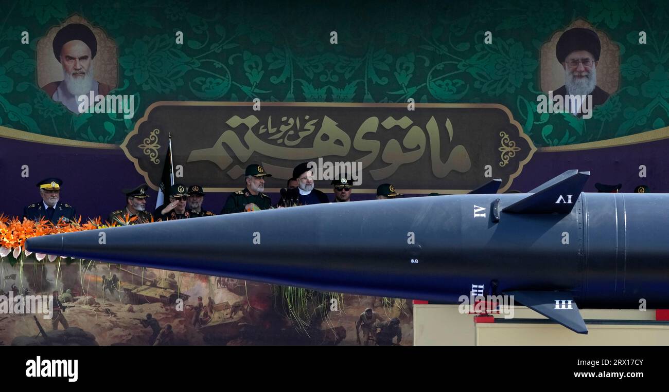 Iranian President Ebrahim Raisi, wearing black turban at center ...