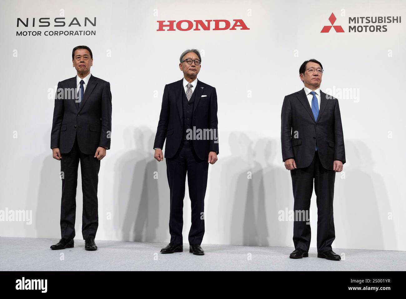 Nissan Chief Executive Makoto Uchida, left, Honda Chief Executive ...