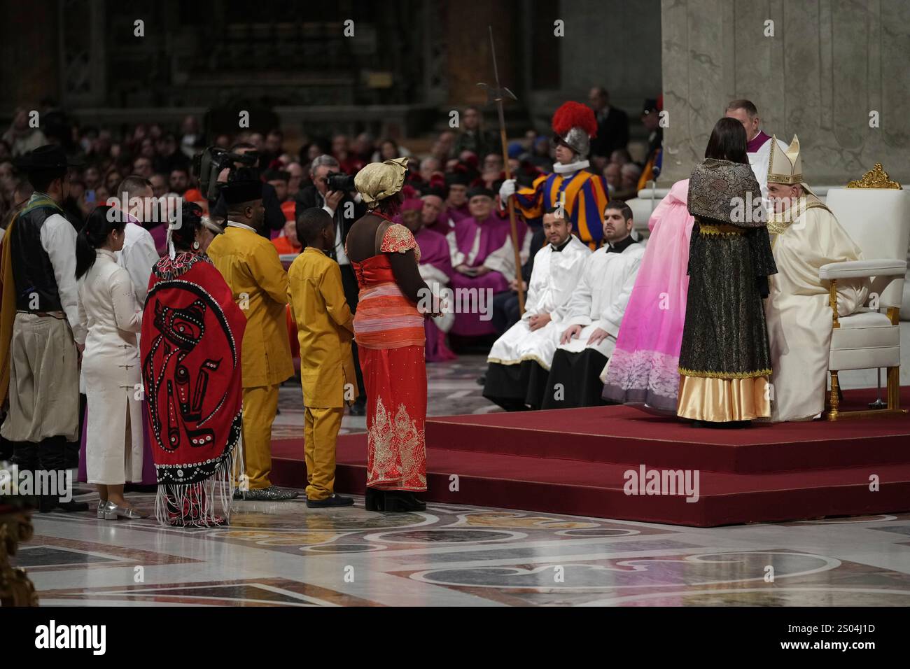 Faithful in traditional costumes bring the offertory during the ...