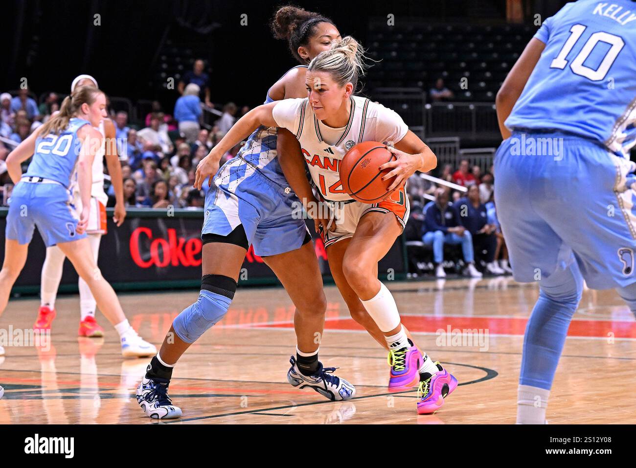 CORAL GABLES, FL - DECEMBER 29: Miami guard Haley Cavinder (14) drives ...