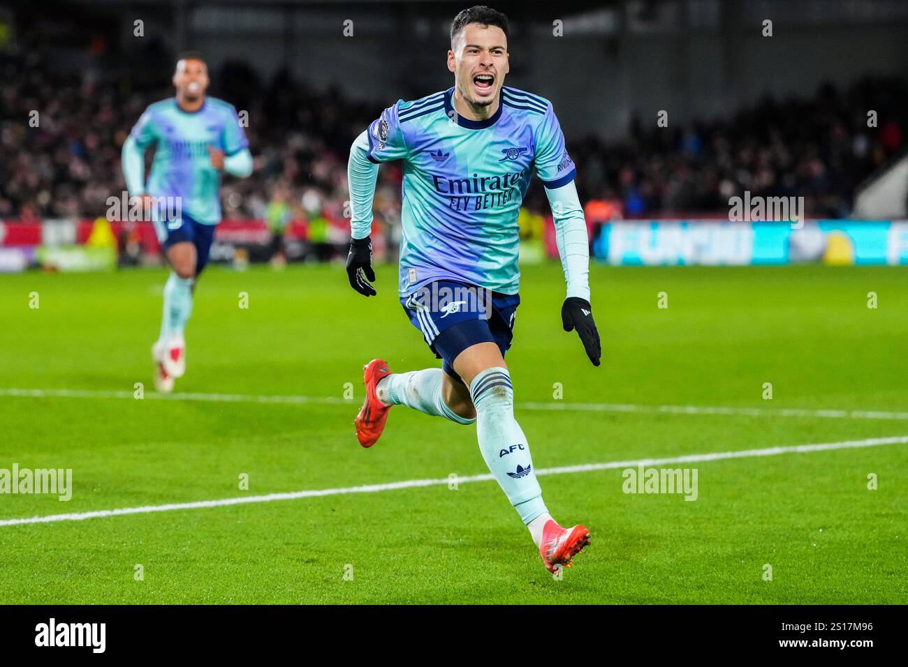 Arsenal's Gabriel Martinelli celebrates after scoring his side third ...