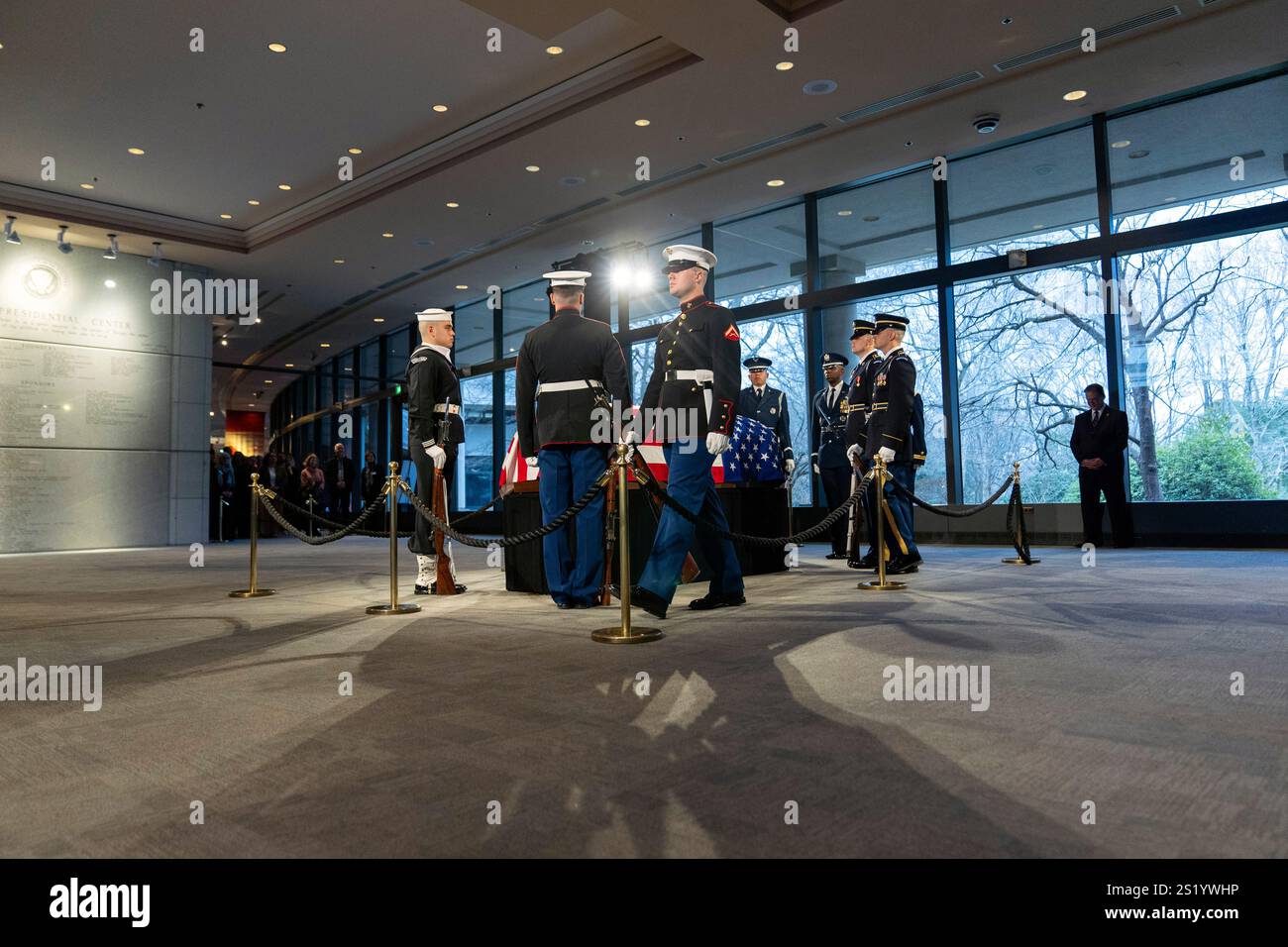 Mourners view the casket of former President Jimmy Carter as he lies in ...