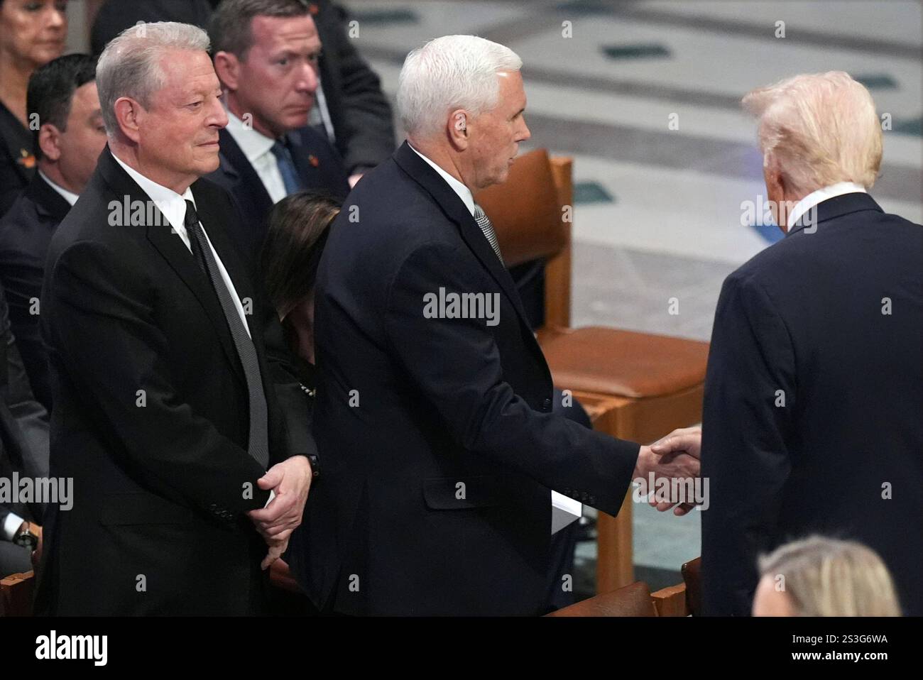 President-elect Donald Trump shakes hands with former Vice President Mike Pence as former Vice ...