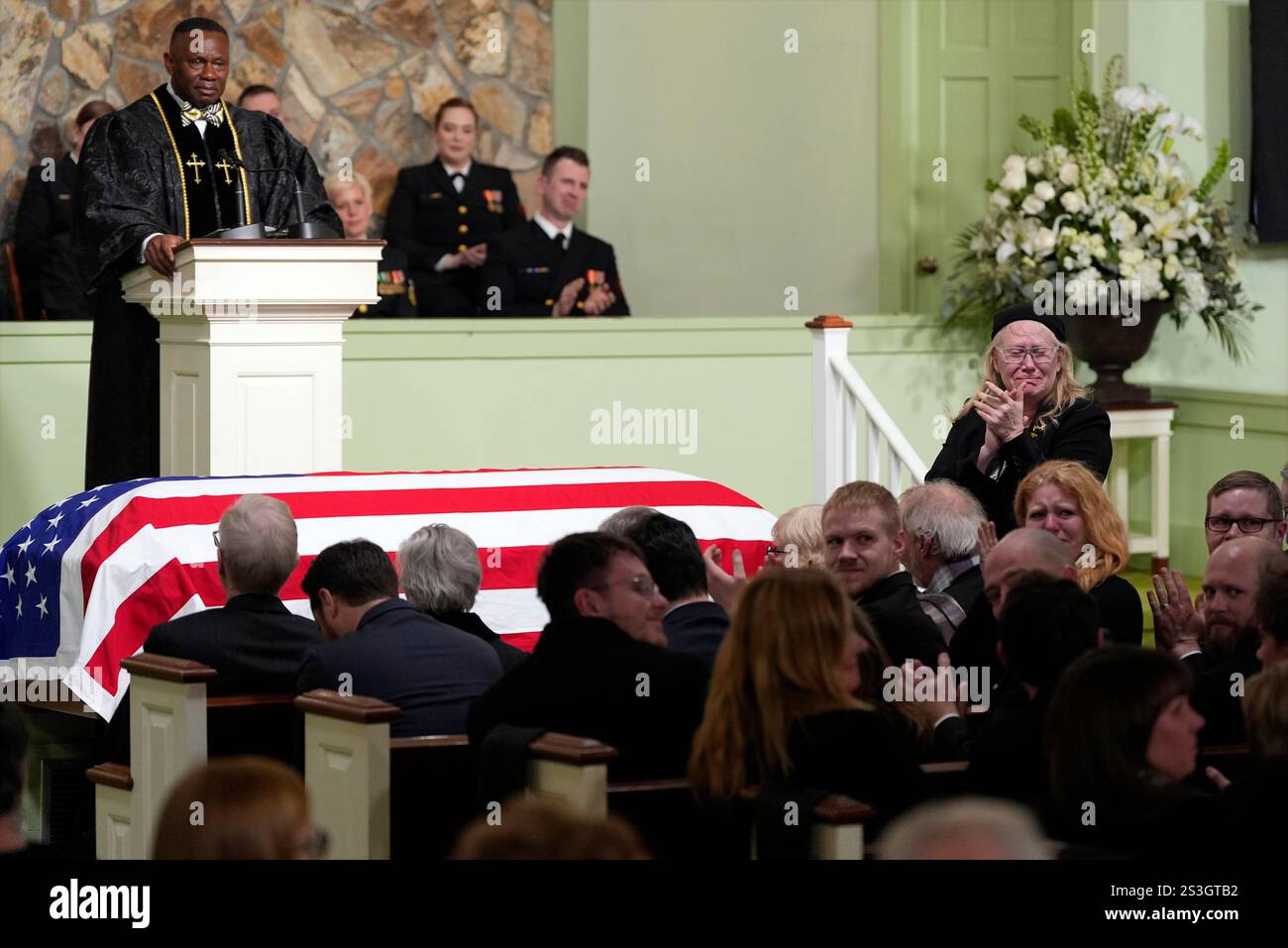 Pastor Tony Lowden recognizes Mary Prince as Amy Carter applauds during ...