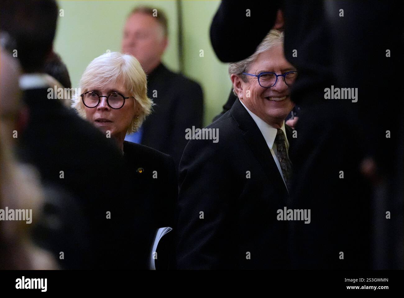 James "Chip" Carter and his wife Becky, depart after the funeral ...