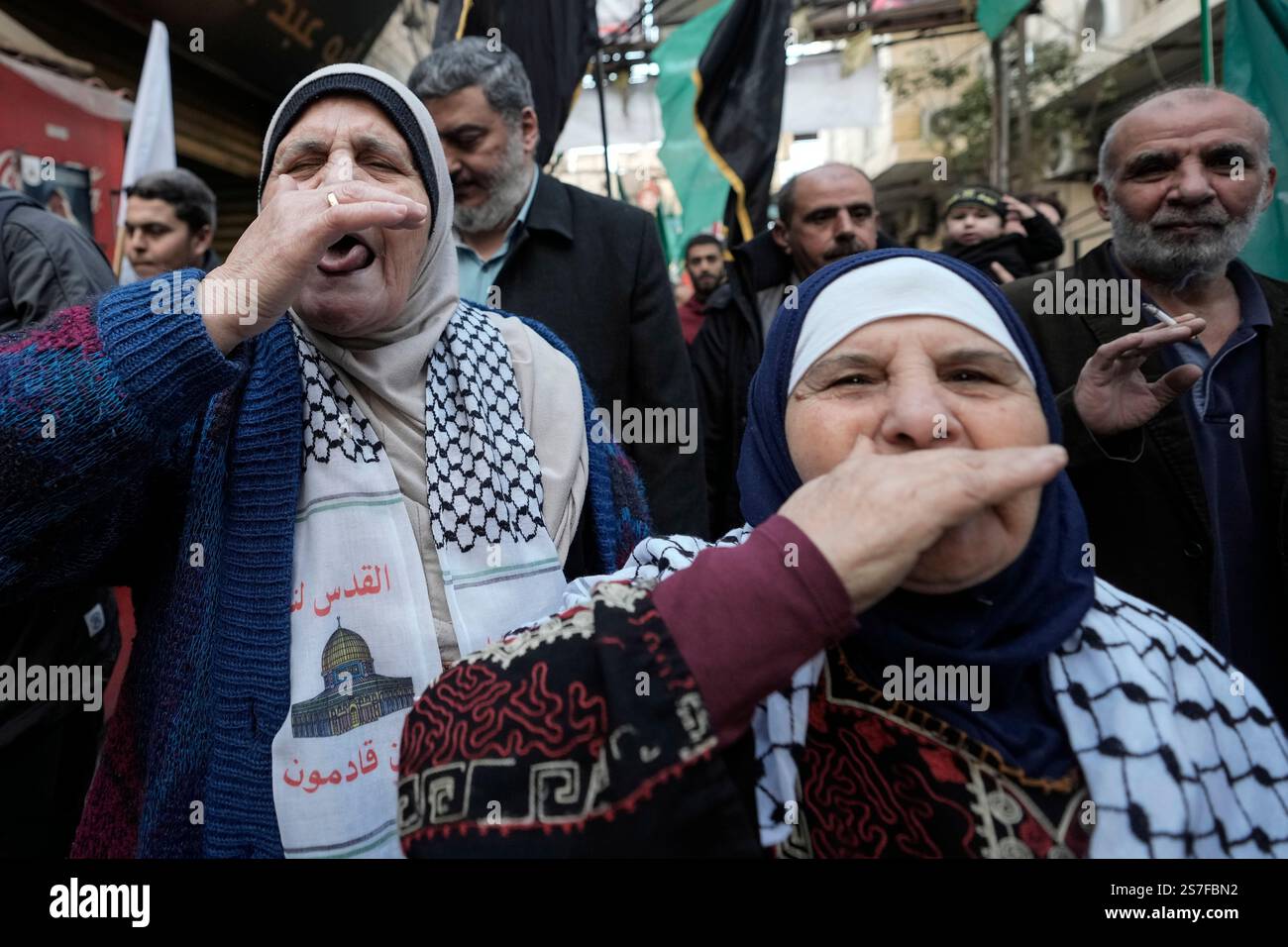 Palestinians let out a "zaghrouta" or joyous yell to celebrate a ...