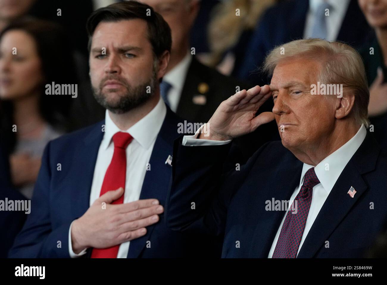 President Donald Trump and Vice President JD Vance listen to ...