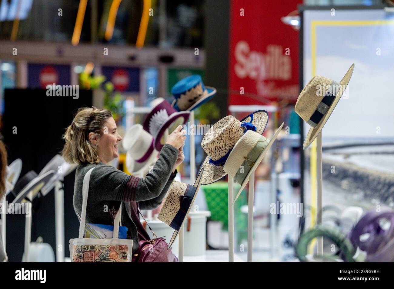 A woman at a stand during the International Tourism Fair (Fitur) at ...