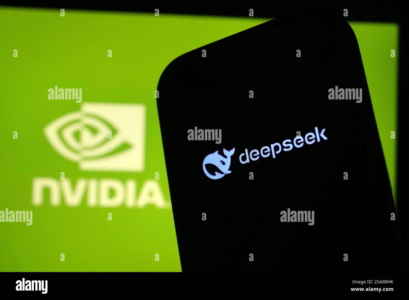 A photo shows the logos of deepseek on a smart phone and NVIDIA in ...