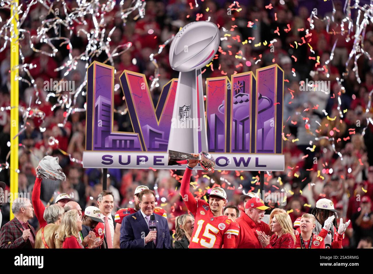FILE - Kansas City Chiefs quarterback Patrick Mahomes raises the ...