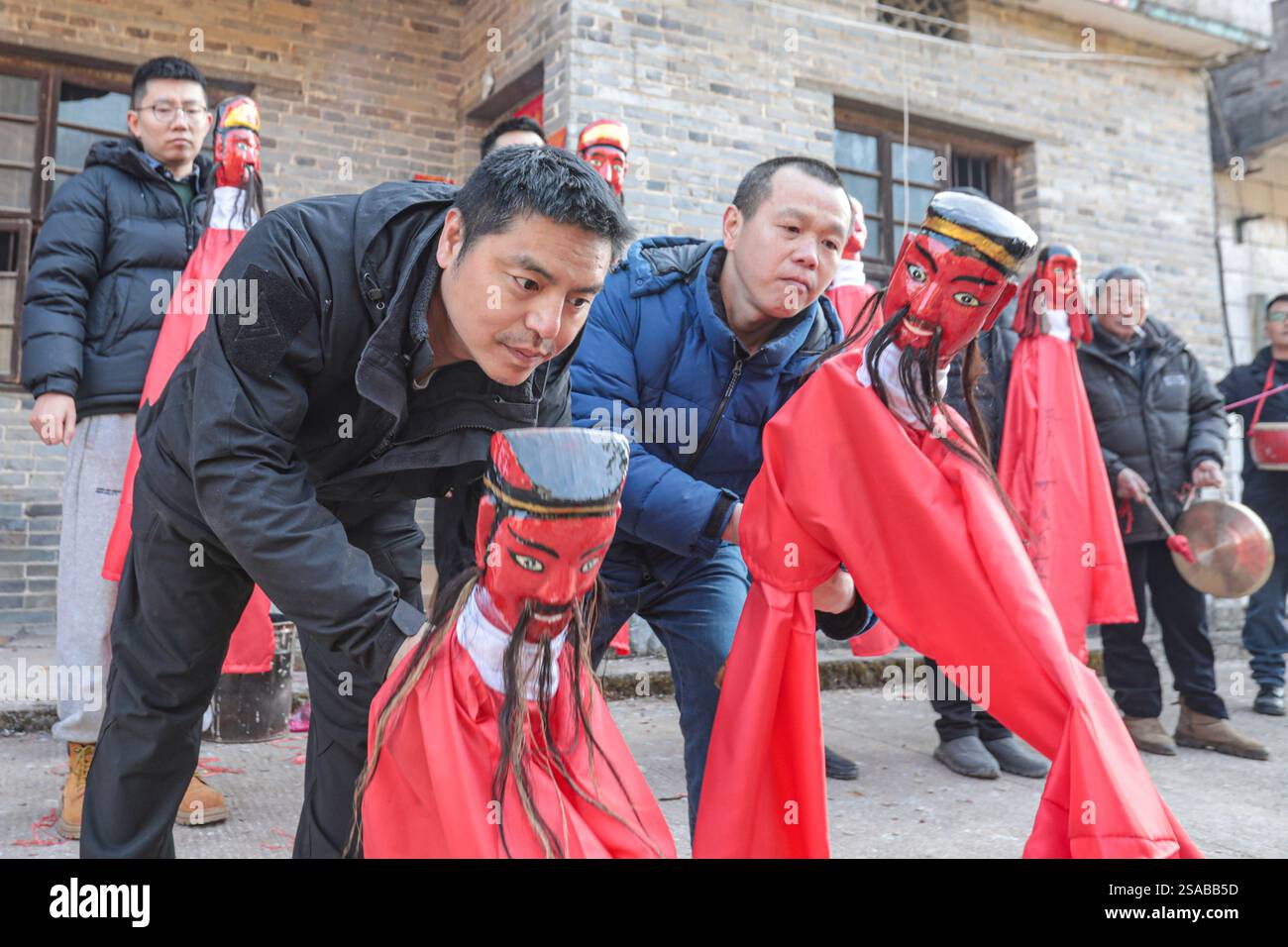 Villagers perform with the figureheads in the traditional event of Pan ...