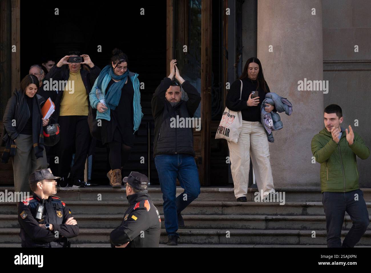 The defendants leave the Barcelona Court during a rally in support of ...