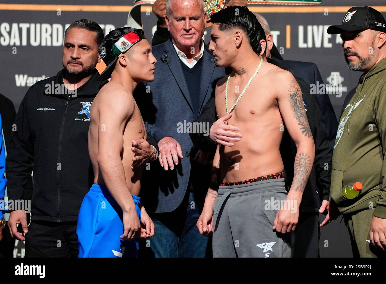 Isaac Cruz, left, and Angel Fierro face off during a ceremonial weigh ...