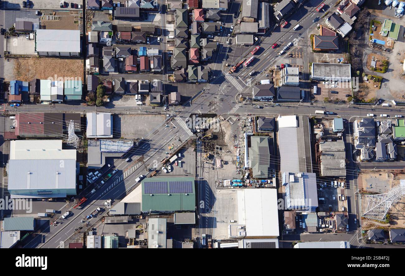 An aerial photo shows sinkholes at an intersection in Yashio City ...