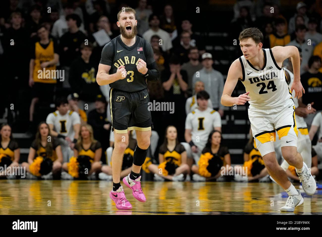 Purdue guard Braden Smith (3) celebrates in front of Iowa forward Pryce ...