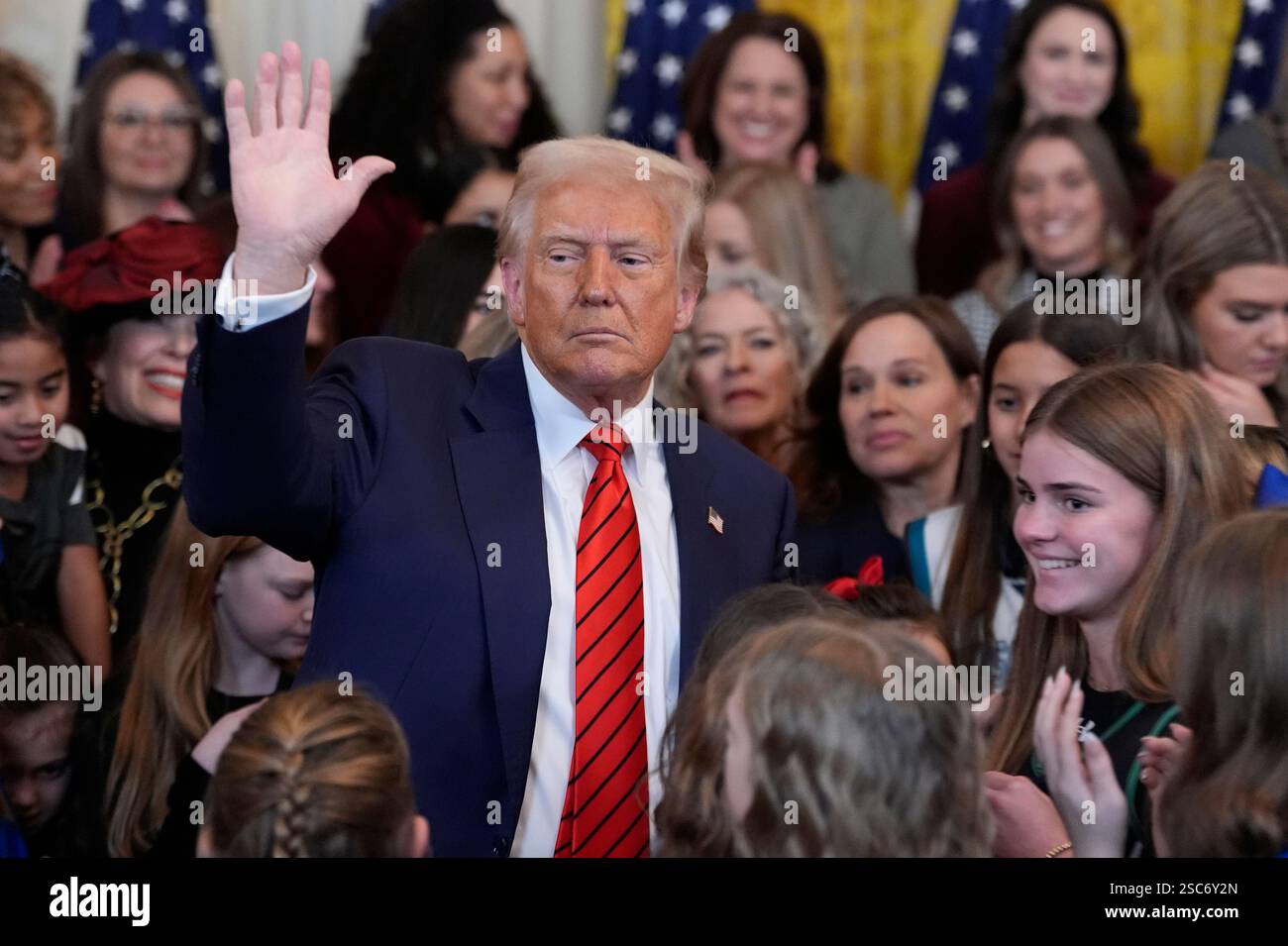 President Donald Trump waves after signing an executive order barring ...