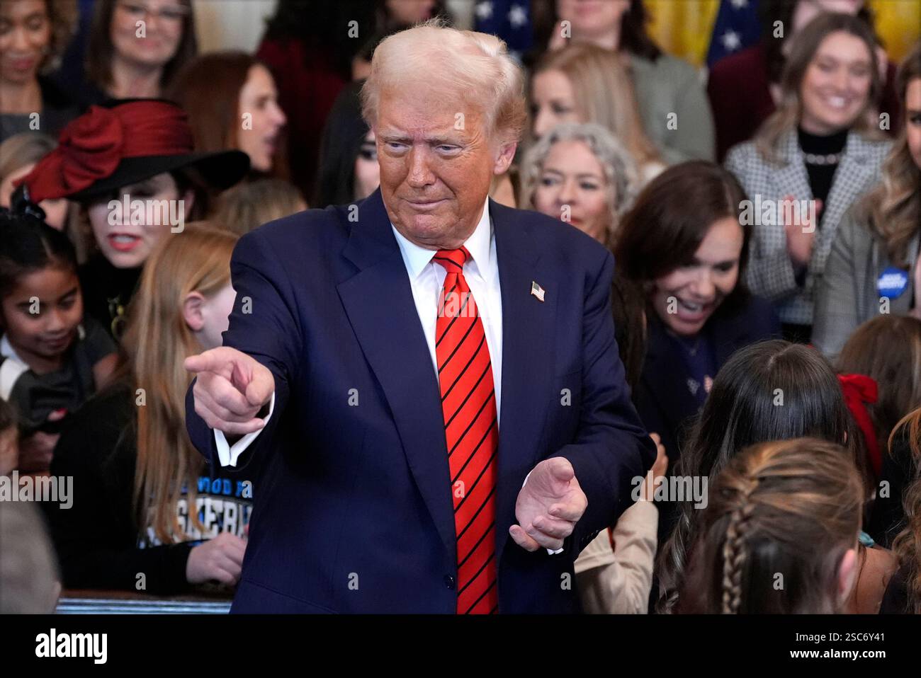 President Donald Trump gestures after signing an executive order ...