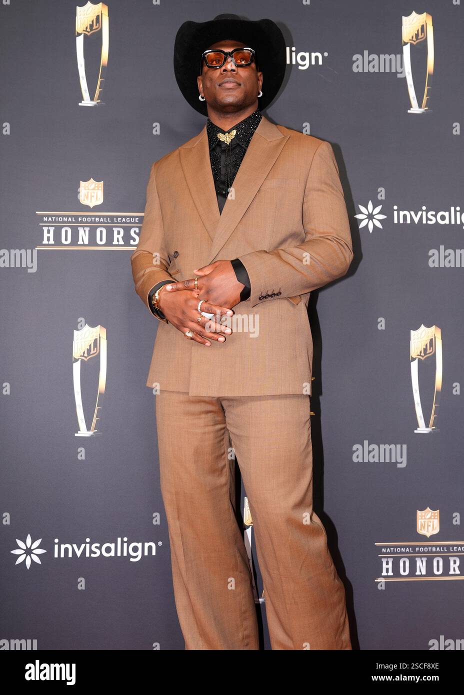Keion White, of the New England Patriots, poses on the red carpet at ...
