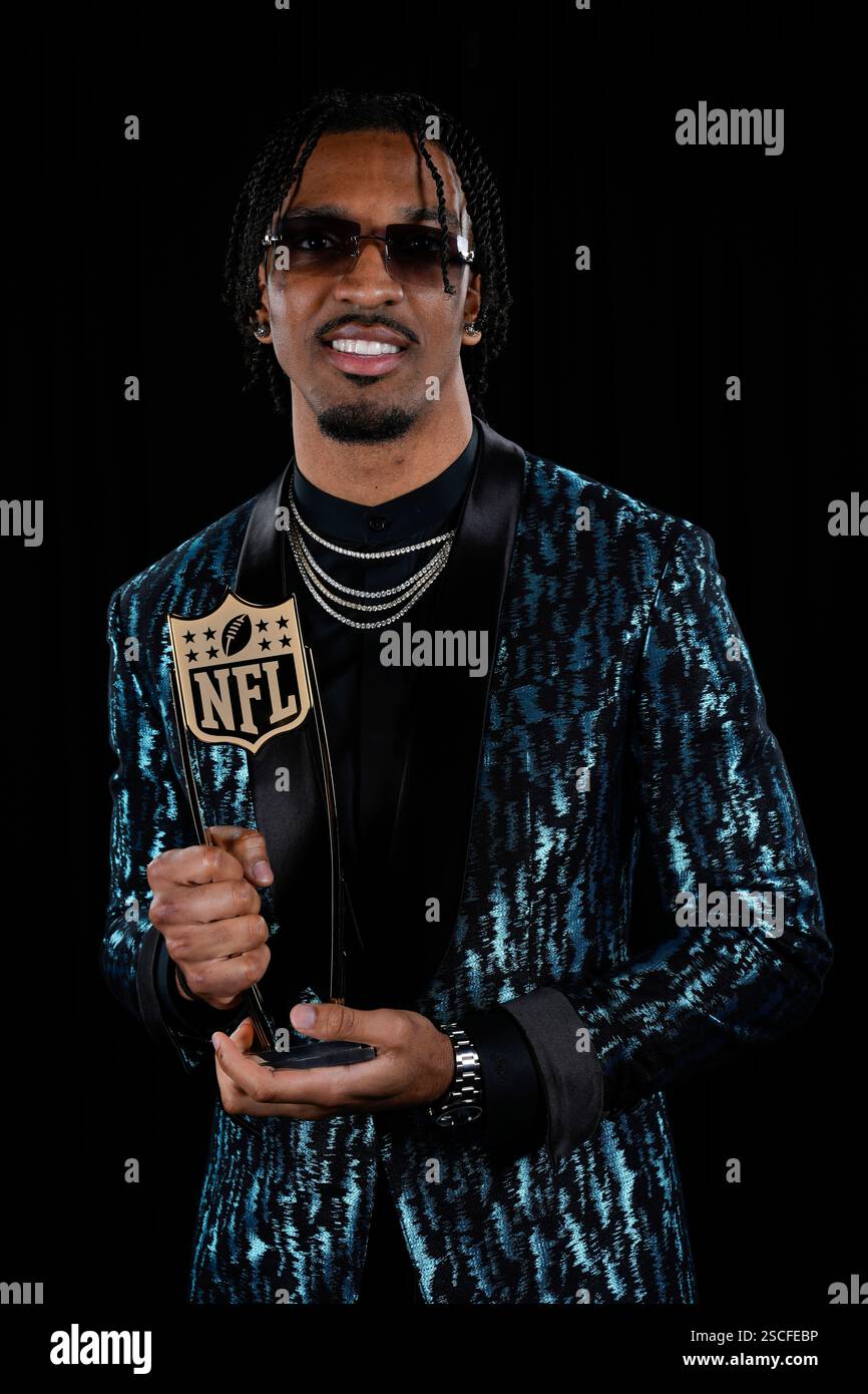 Washington Commanders' Jayden Daniels, AP NFL Offensive Rookie of the Year, poses after winning ...