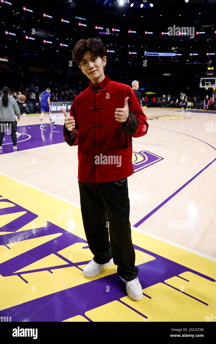 Chinese actor and singer Ren Jialun attends an NBA basketball game ...
