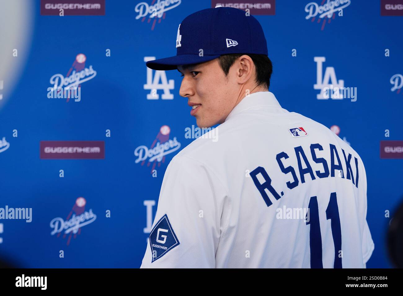 FILE - New Los Angeles Dodgers pitcher Roki Sasaki poses during a a ...