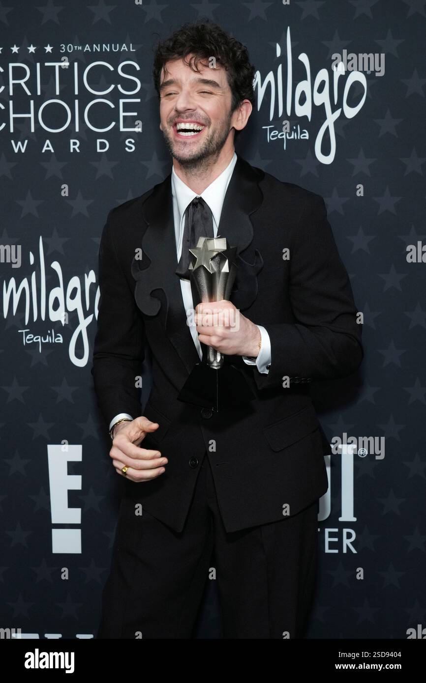 Michael Urie poses in the press room with the award for best supporting ...