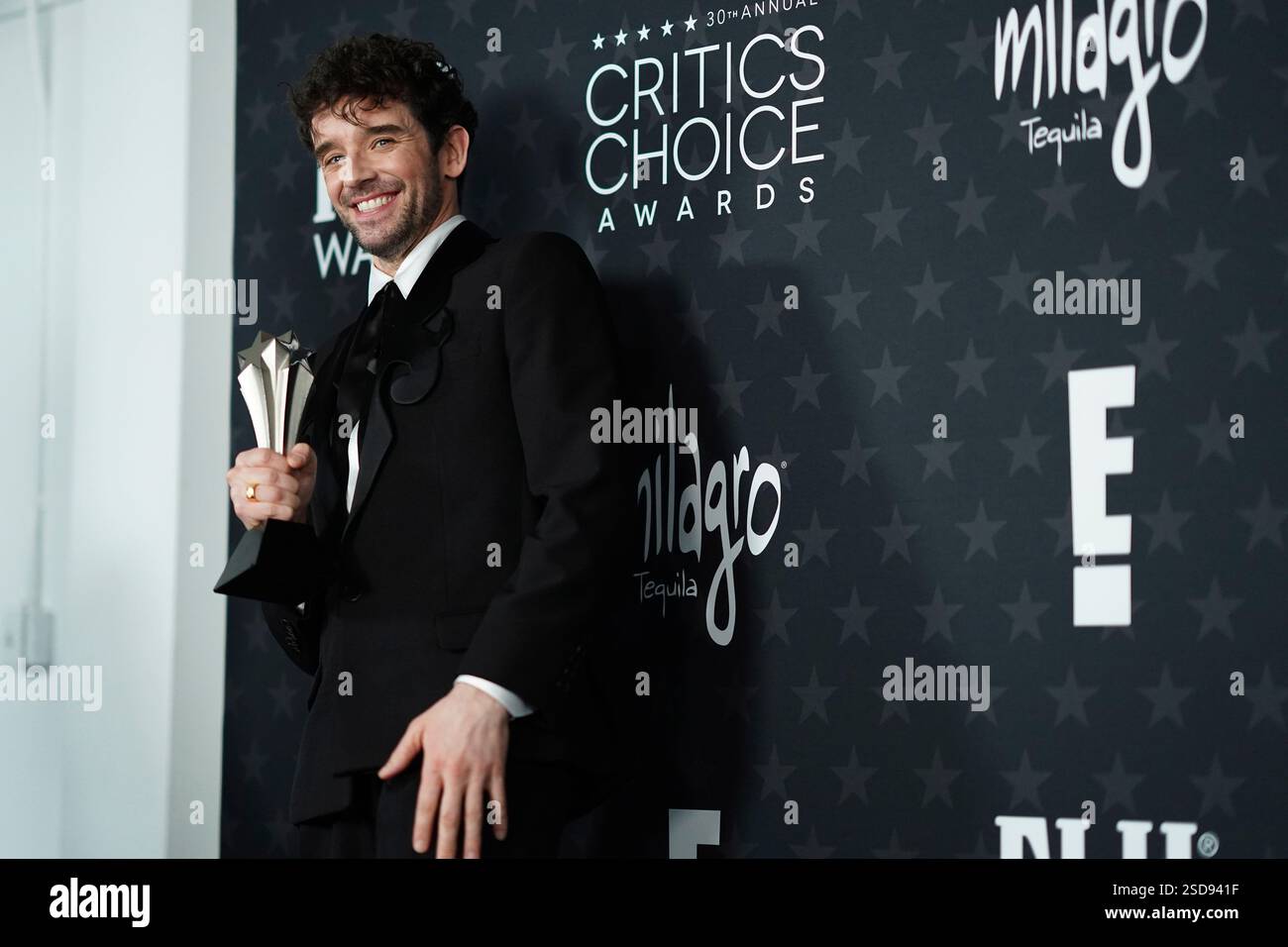 Michael Urie poses in the press room with the award for best supporting ...
