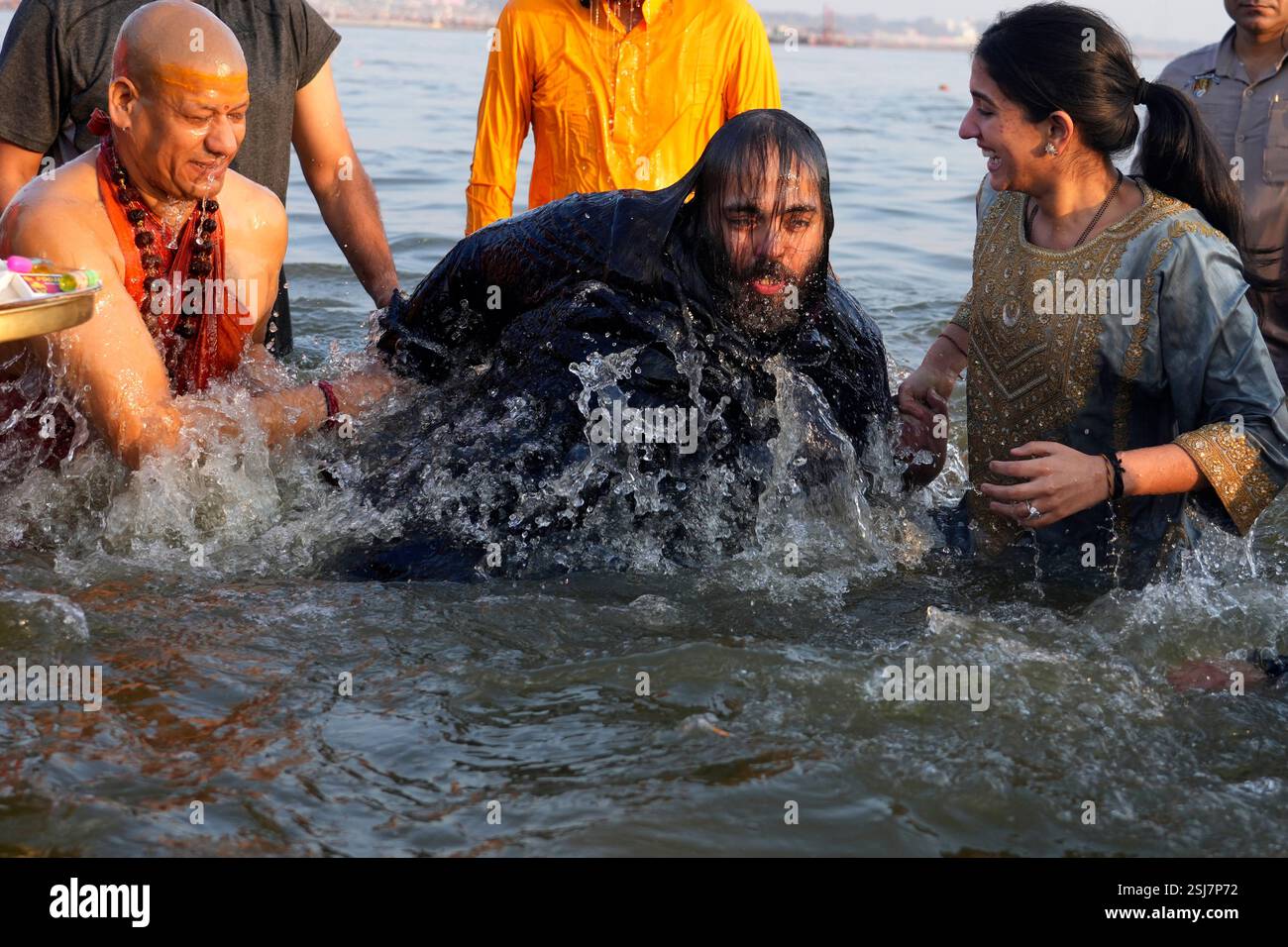 Swami Kailashanand Saraswati helps Anant Ambani, center, and Radhika ...