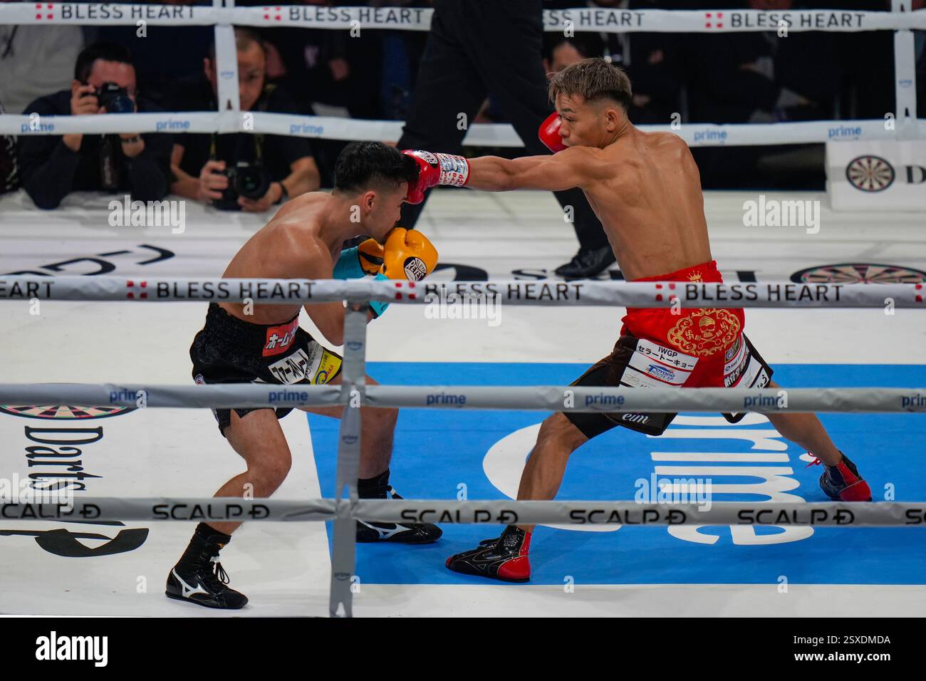 Daigo Higa , left, of Japan fight with Seiya Tsutsumi , right, of Japan during the WBA ...