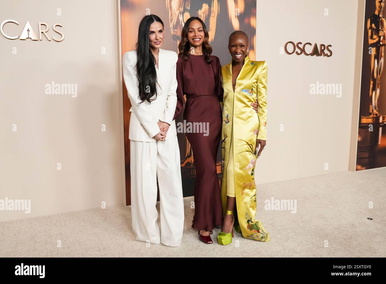 Demi Moore, from left, Zoe Saldana, and Cynthia Erivo arrive at the ...