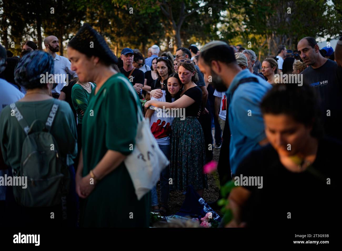 Mourners gather around the graves of British-Israelis Lianne Sharabi ...