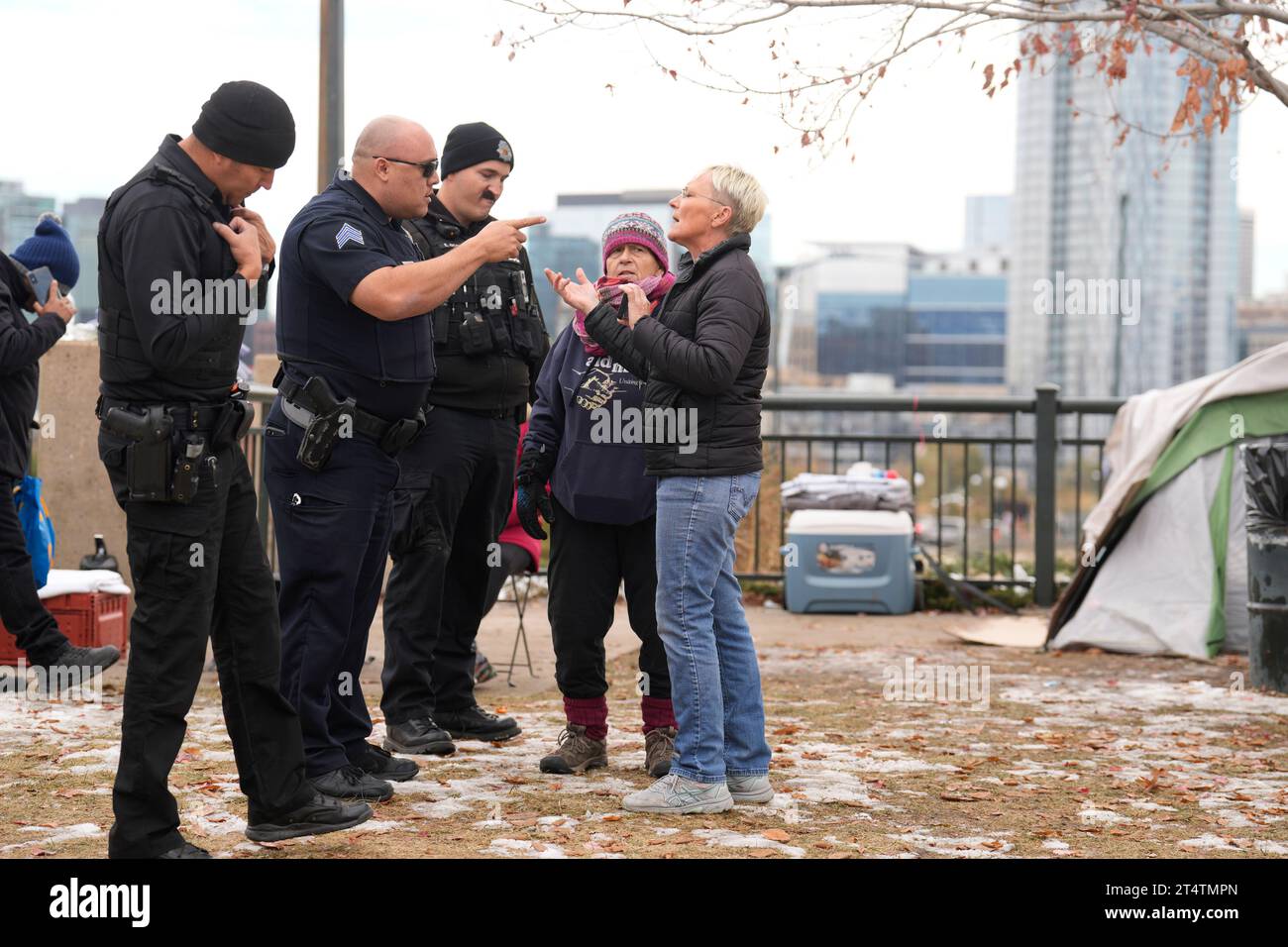 Denver Police Departmnt officers direct homeless advocate Amy Beck to ...