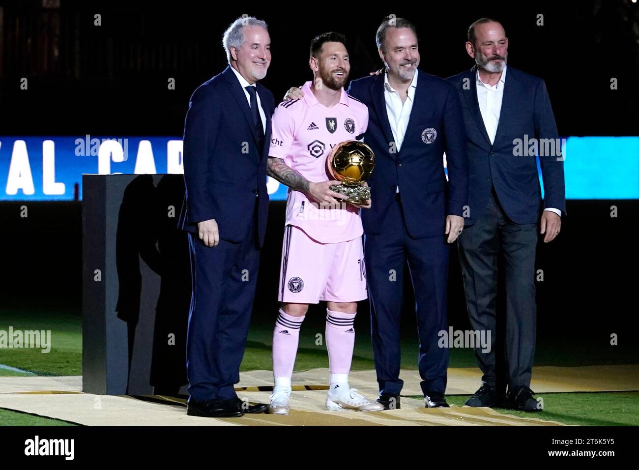 Inter Miami forward Lionel Messi, second form left, holds his Ballon d ...