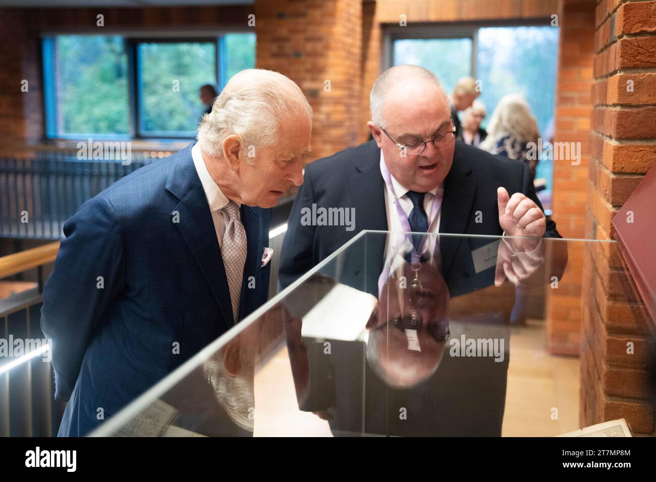 Britain's King Charles III looks at religious books during a reception ...
