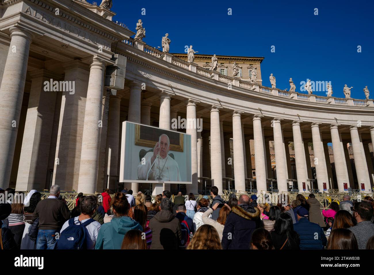Pope Francis appears on a giant monitor set up in St. Peter's Square at ...
