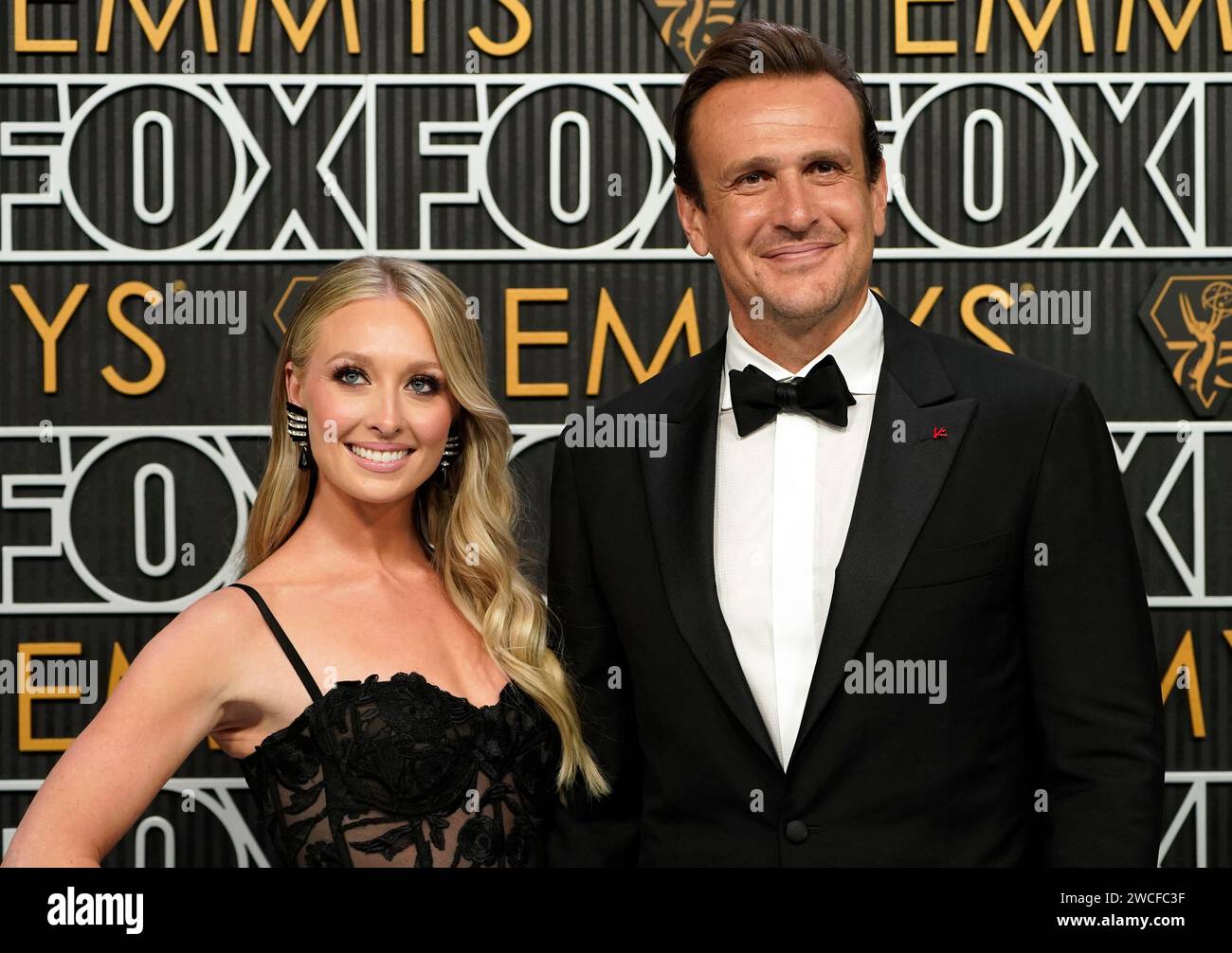 Kayla Radomski, left, and Jason Segel pose for a Red Carpet portrait at ...